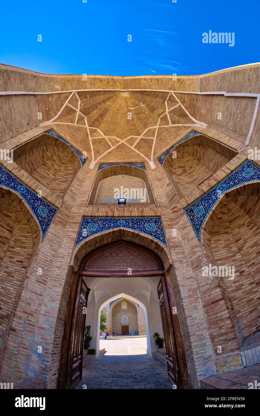 The Madrasah was built of brick and topped with three blue domes. The ...