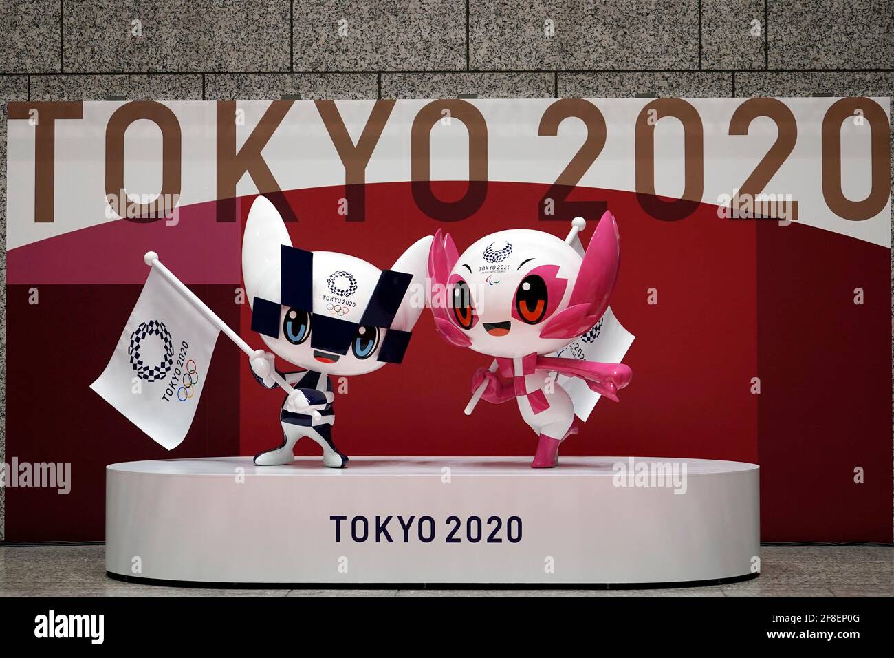 Tokyo, JPN. 14th Apr, 2021. The unveiled statues of Miraitowa, center ...