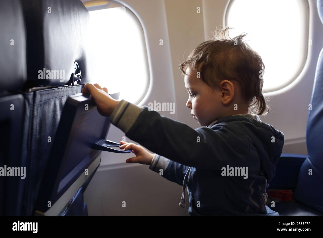 Portrait of little child at an airplane Stock Photo - Alamy