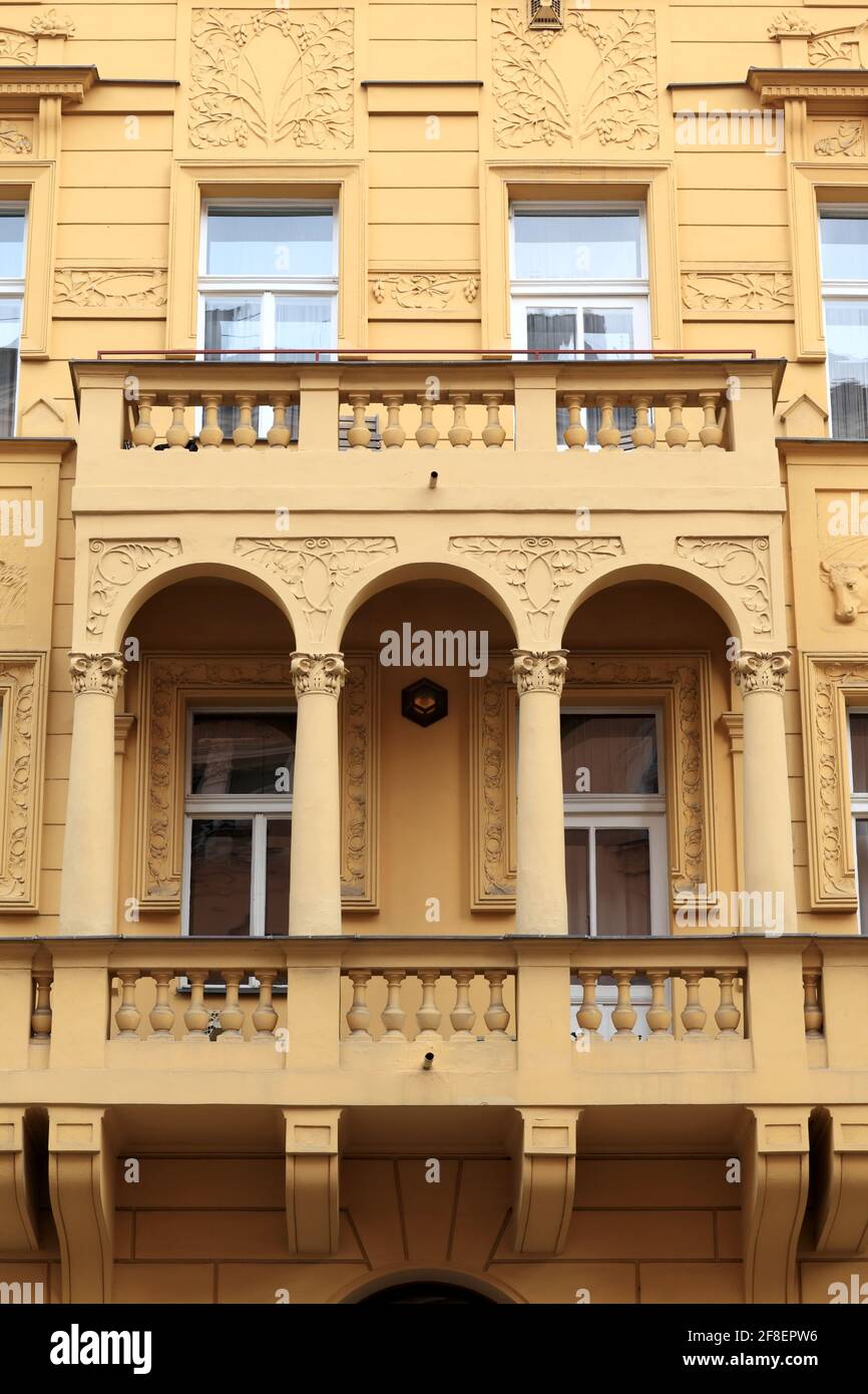 Balcony of yellow building in old Prague Stock Photo - Alamy