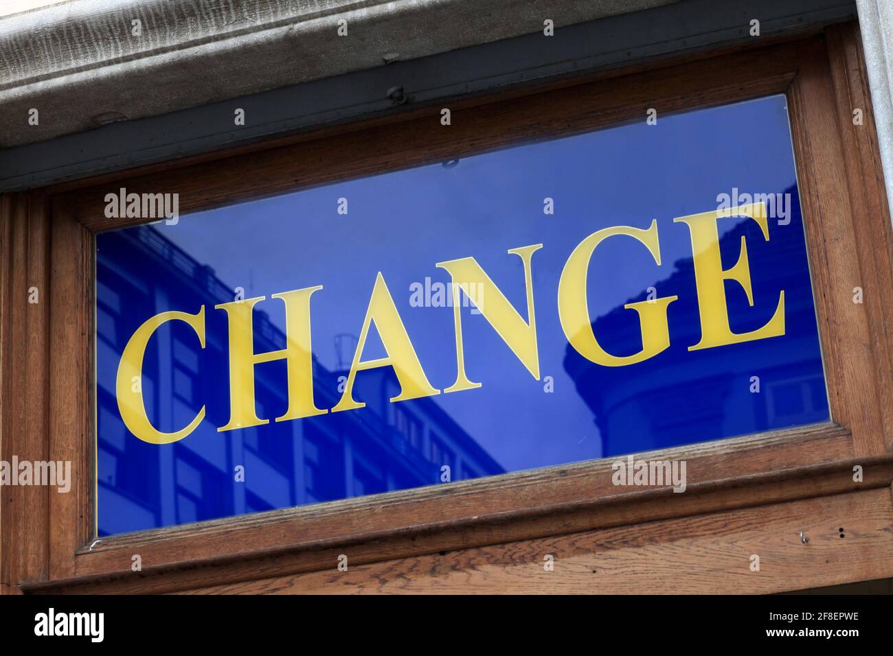 Blue change signboard on a street of city Stock Photo - Alamy