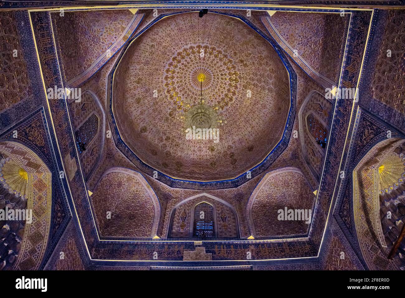 The inner dome drips an intricate gilded coating around high lattice ...