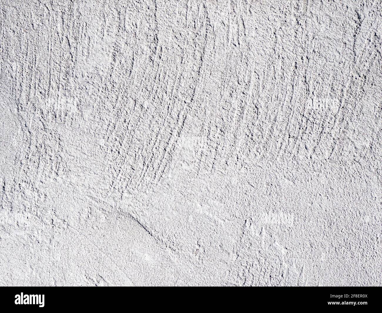 white plaster wall surface with uneven surface. construction background ...