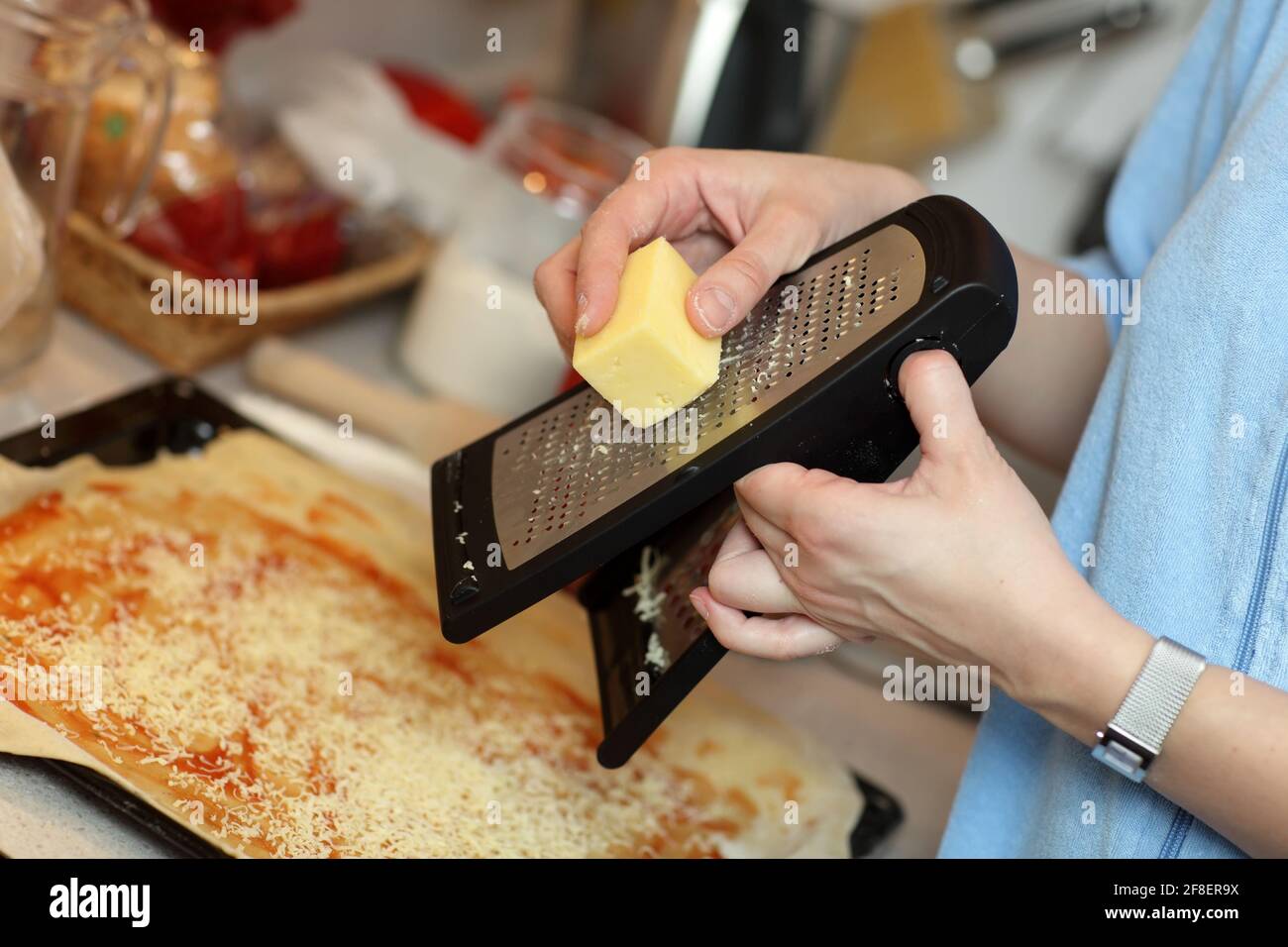 Grating cheese pizza hi-res stock photography and images - Alamy