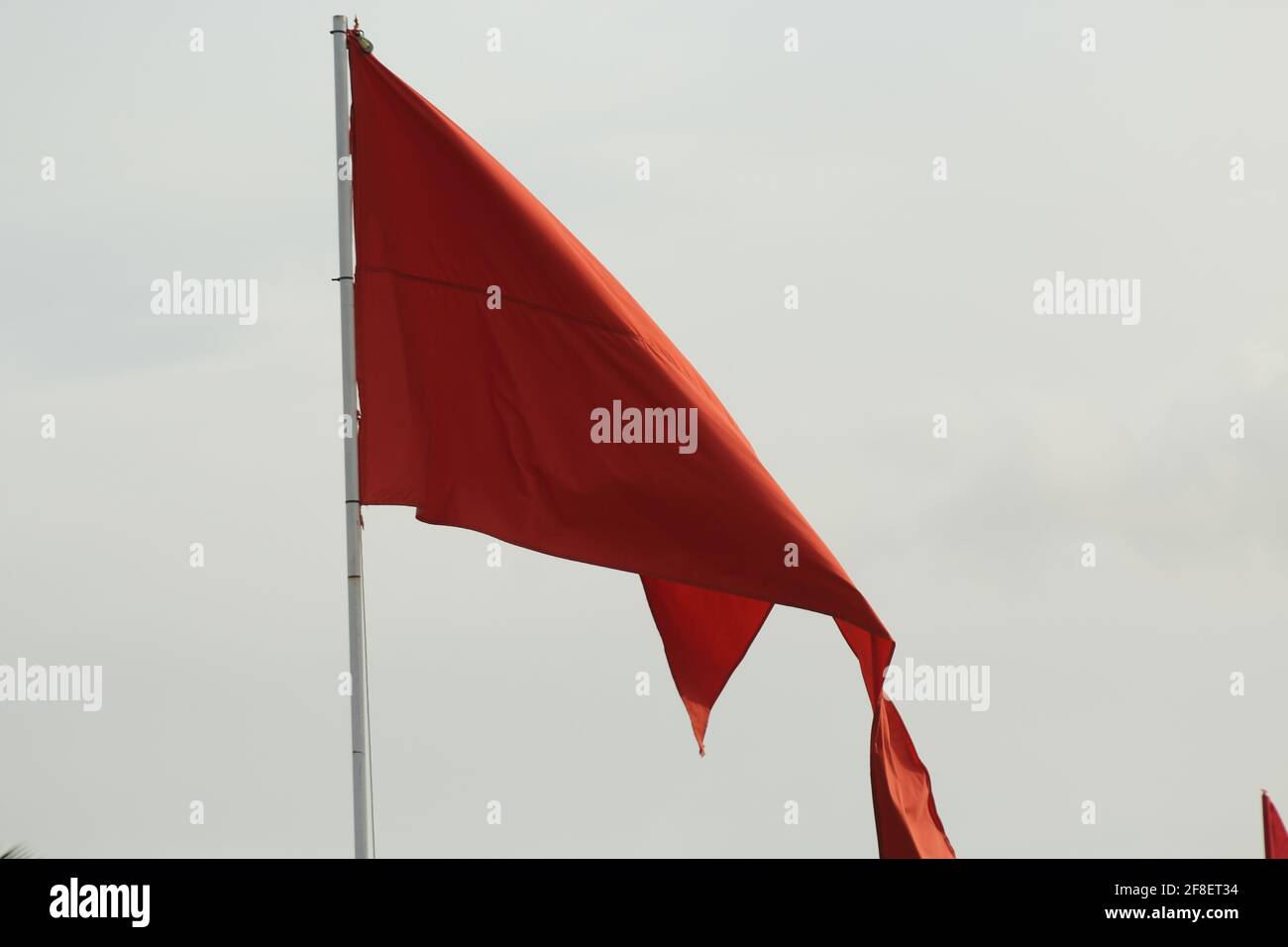 Red Temple Flag Blowing in the Wind Stock Photo - Alamy