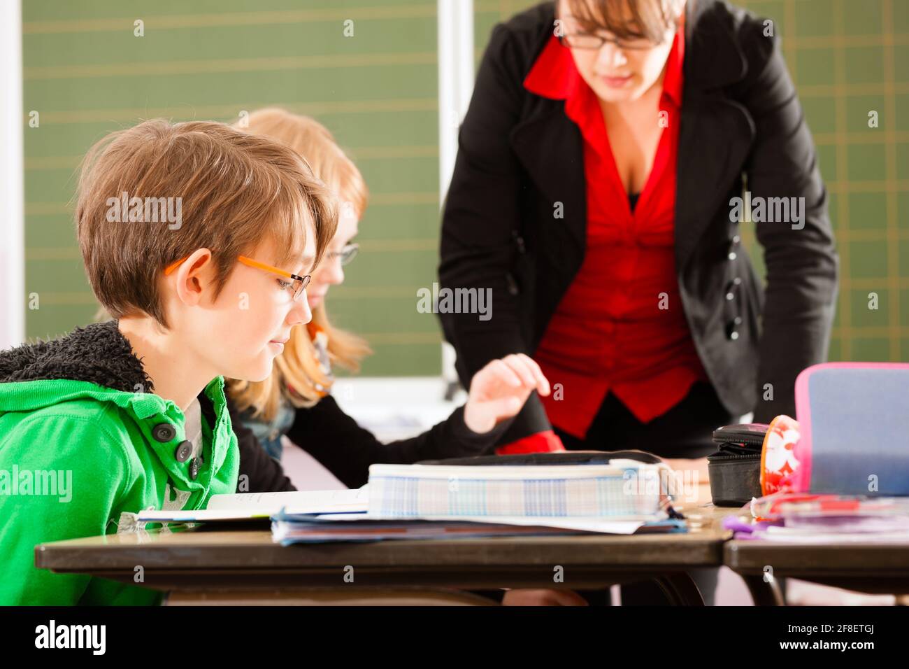 Education - Pupils and teacher learning at elementary or primary school ...