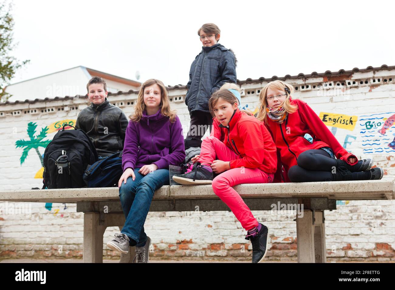 Education - Pupils at schoolyard of their school during recess Stock ...