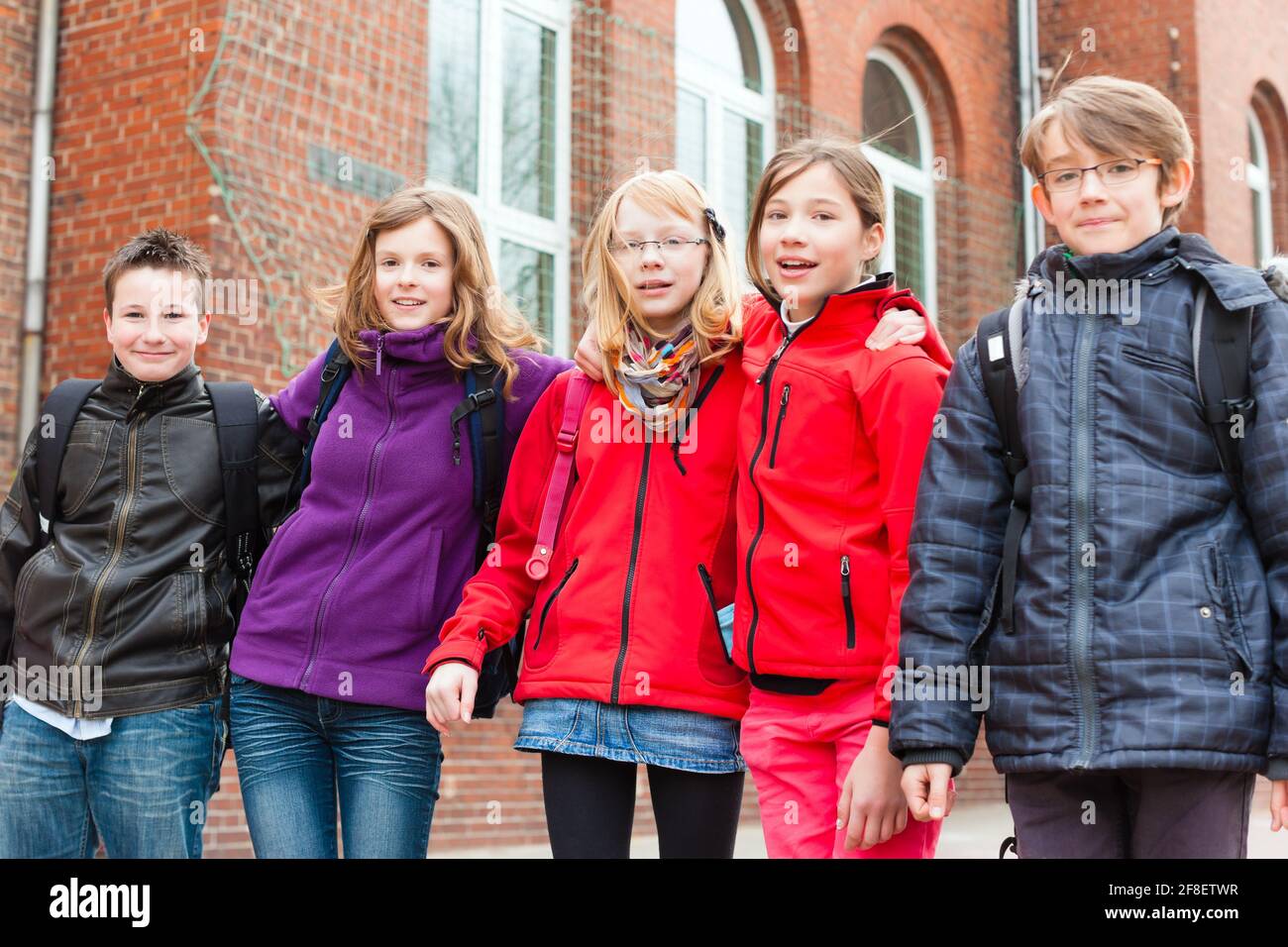 Education - Pupils at schoolyard of their school during recess Stock ...