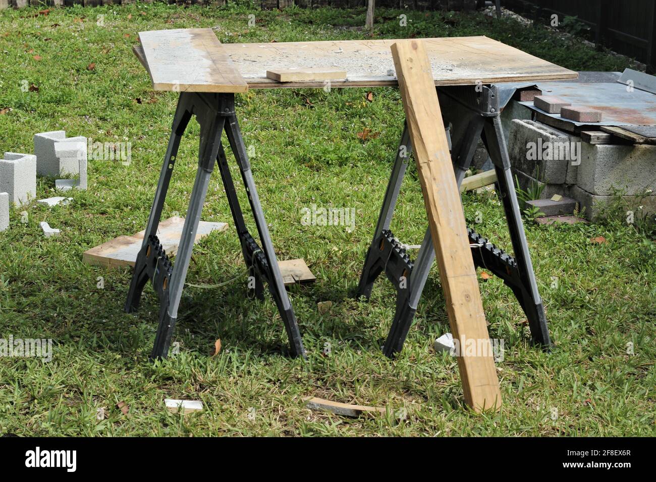 Construction work being performed in a backyard to create a tool shed ...