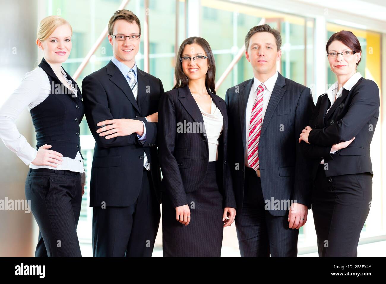 Business - group of businesspeople posing for group photo in office ...