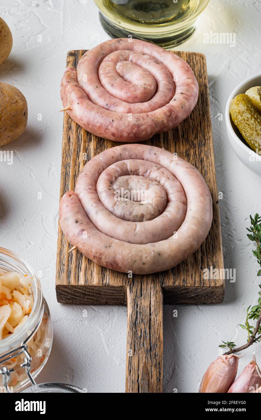 Raw snail sausage in traditional spiral set, on white background Stock ...
