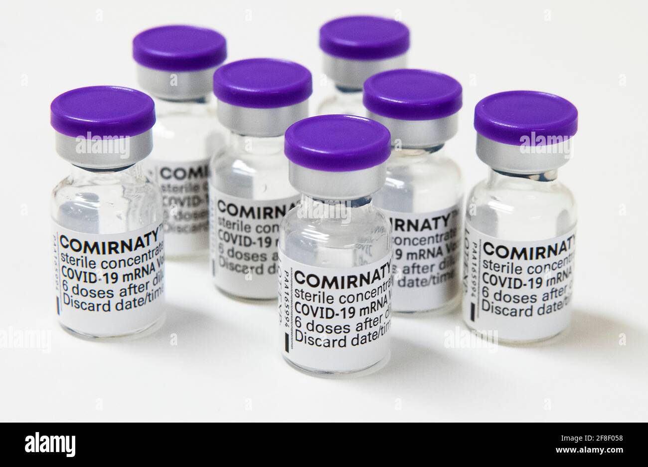 Glass vials with Comirnaty Covid-19 vaccine made by Pfizer/ BioNTech ...