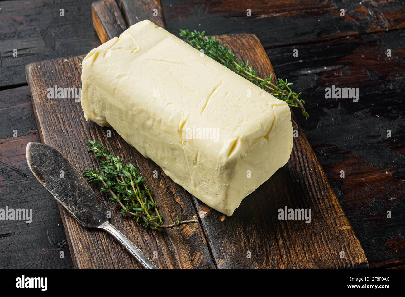 Dairy fresh butter, on old dark wooden table background Stock Photo - Alamy