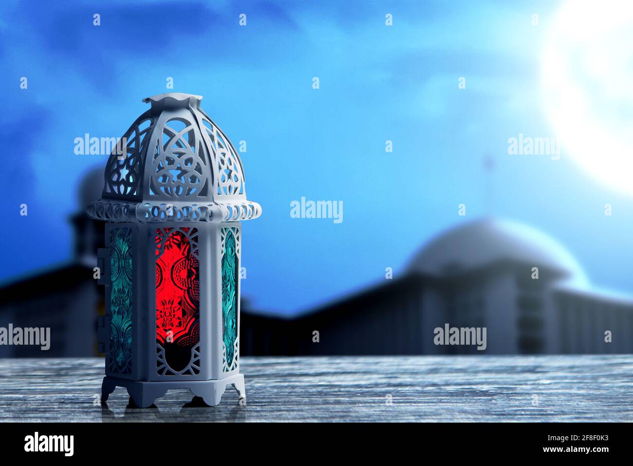 Arabic lamp with colorful light on the table with the night scene ...