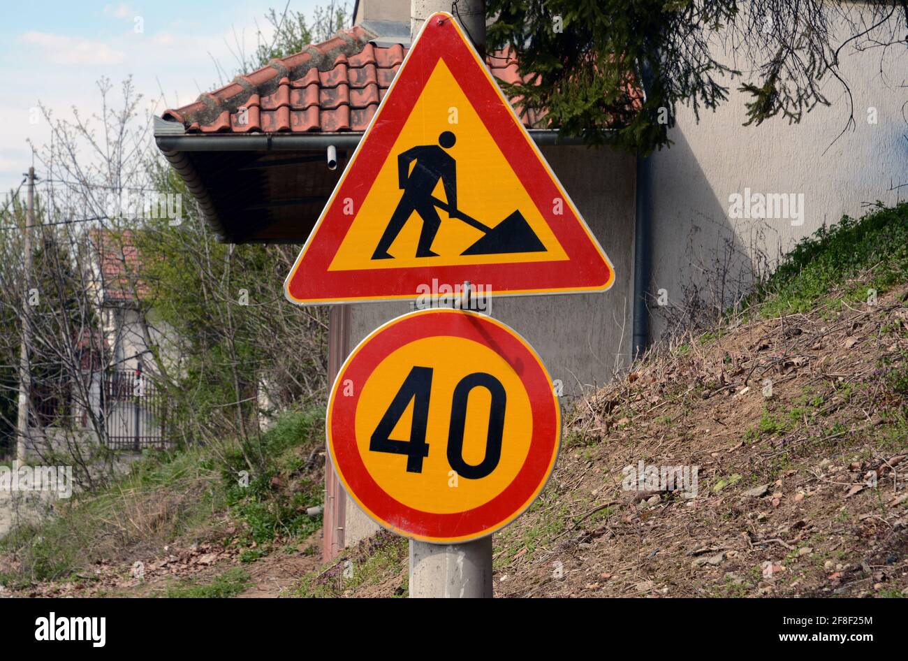 a traffic signs on a metal pole in the street Stock Photo - Alamy