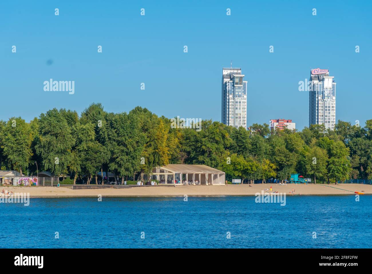 Cityscape of Kiev behind beach at Trukhaniv island, Ukraine Stock Photo ...
