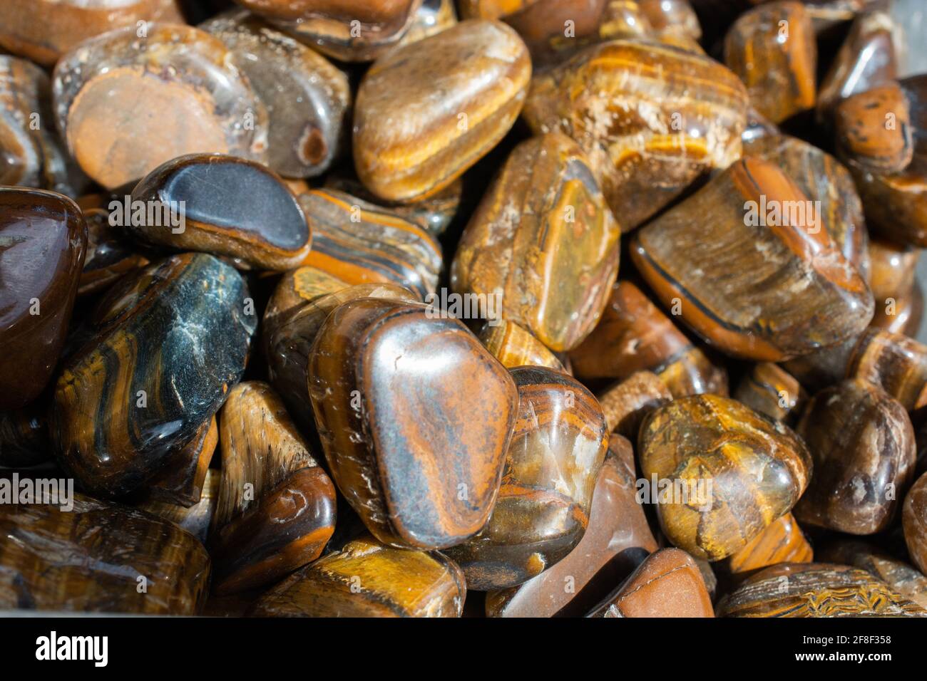 tiger's eye and hawk's eye gemstone as natural mineral rock specimen ...
