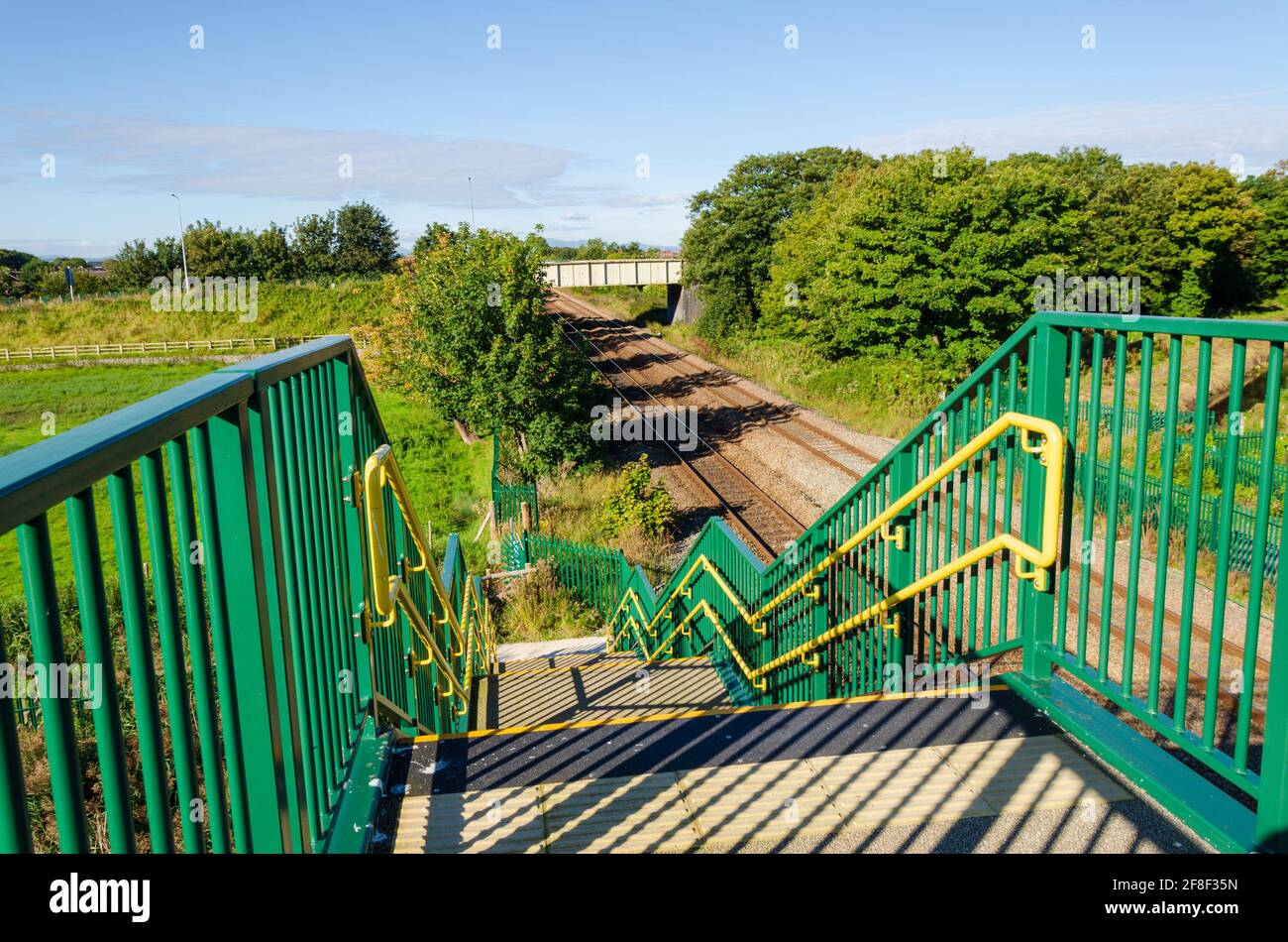 A two line section of railway track with a metal road bridge, seen from ...