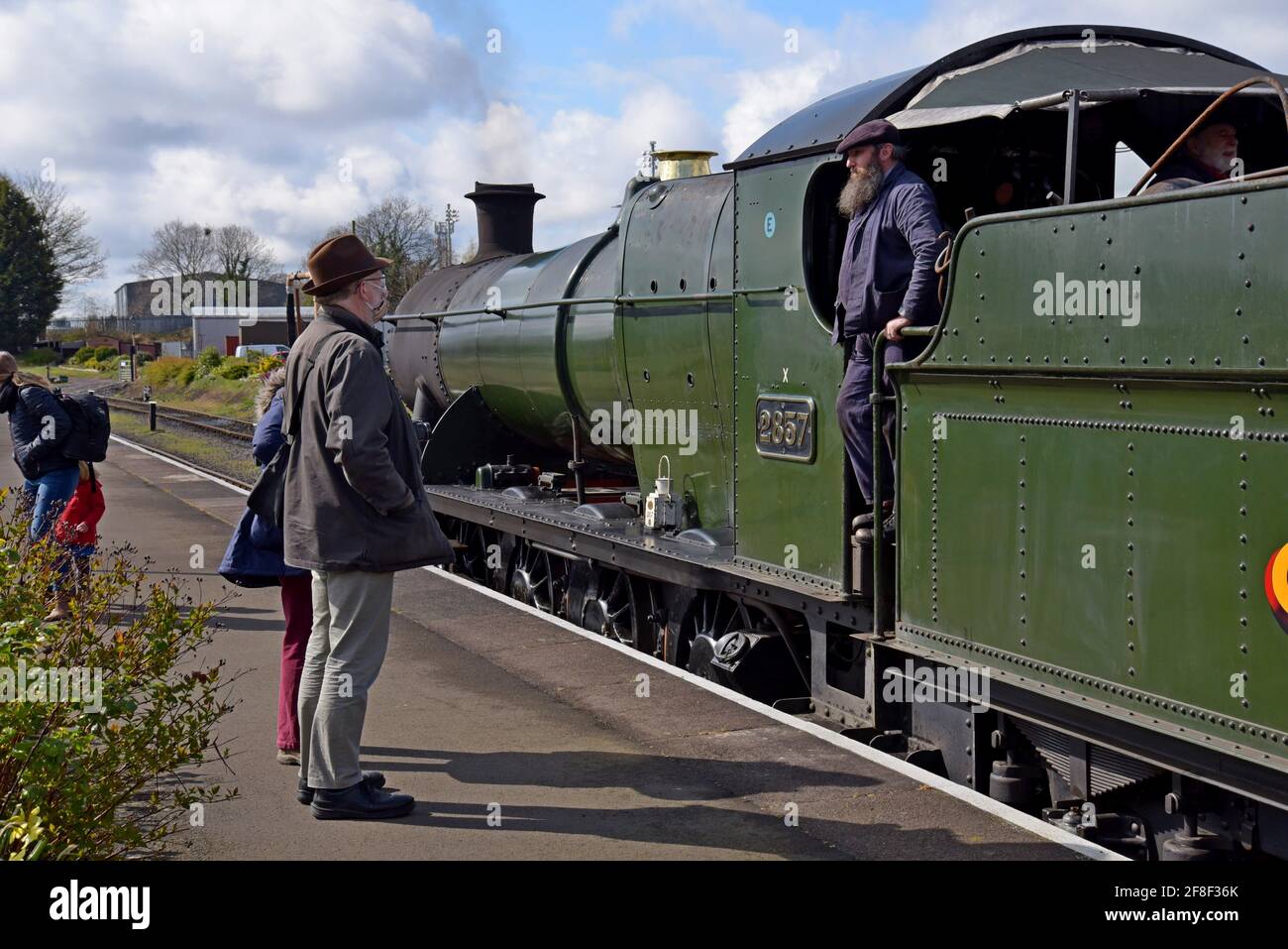Steam train driver chats to passengers at Kidderminster station on the ...