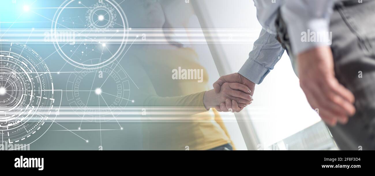 Businesswoman and businessman shaking hands in office; panoramic banner ...