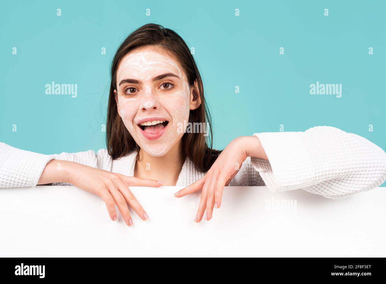 Woman beauty face, portrait of beautiful female model facial mask cream ...