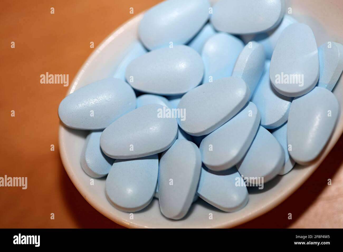 Blue pharmaceutical pills close up medical modern background high ...