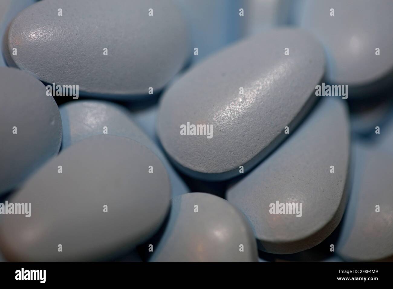 Blue pharmaceutical pills close up medical modern background high ...