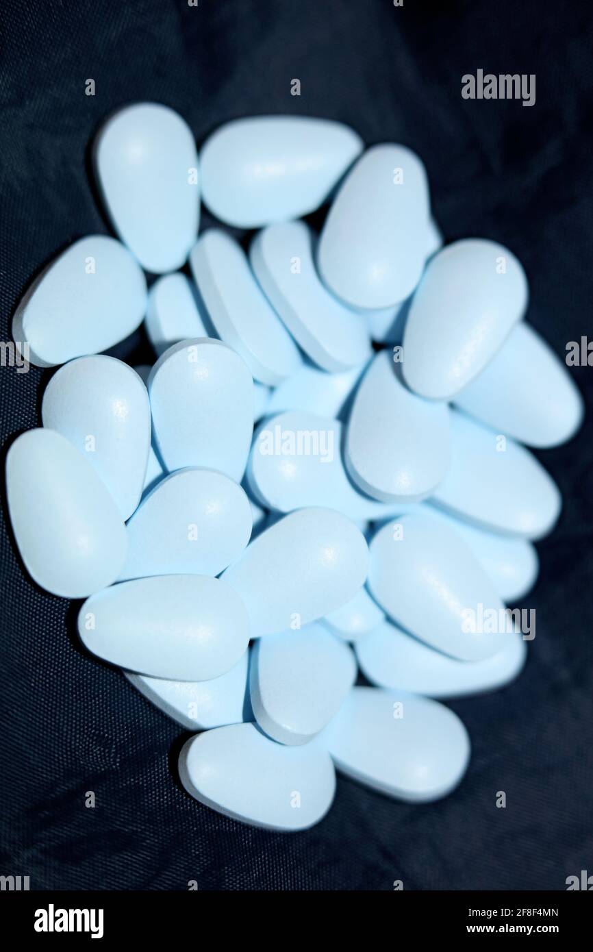 Blue pharmaceutical pills close up medical modern background high ...