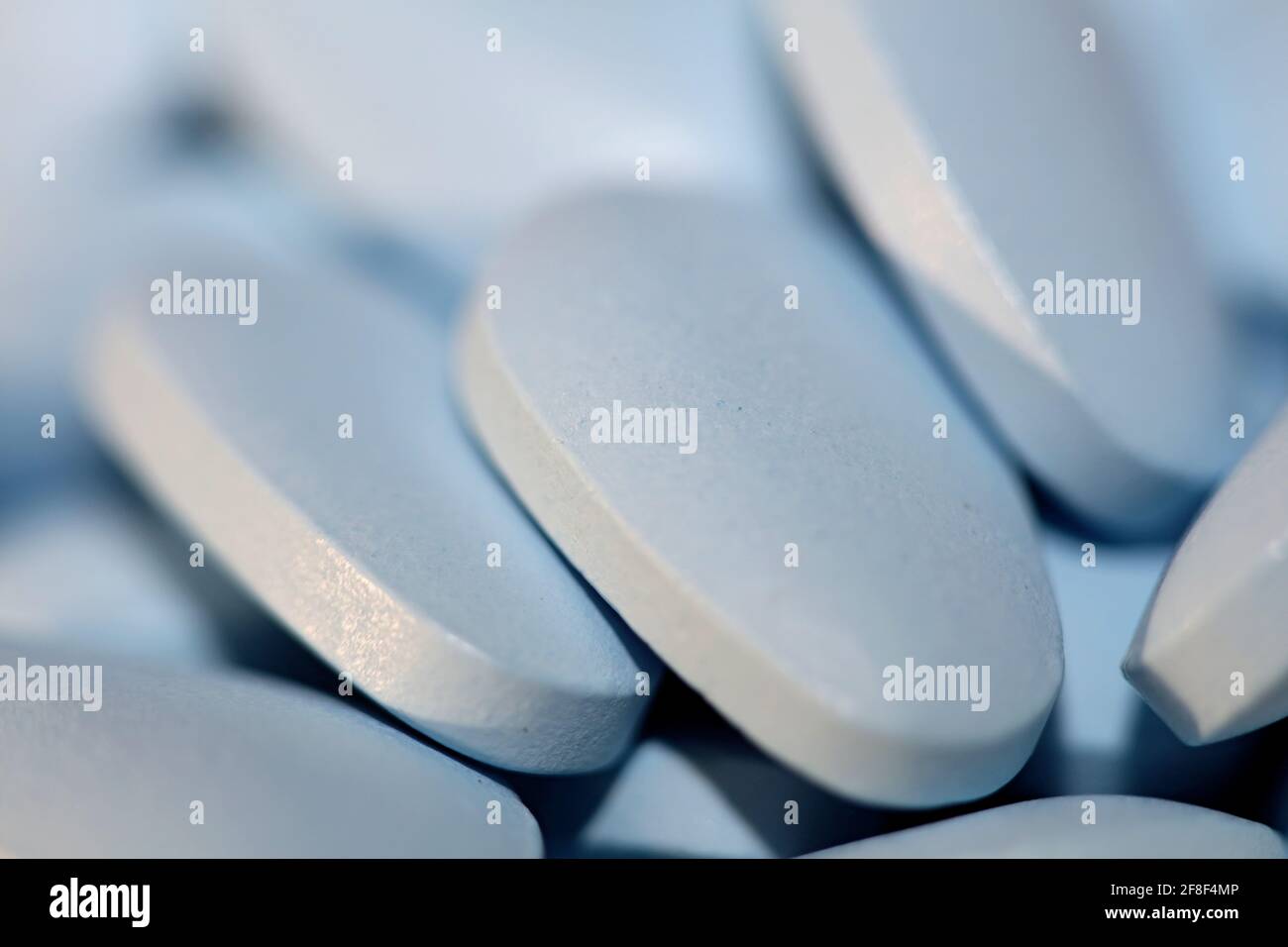 Blue pharmaceutical pills close up medical modern background high ...