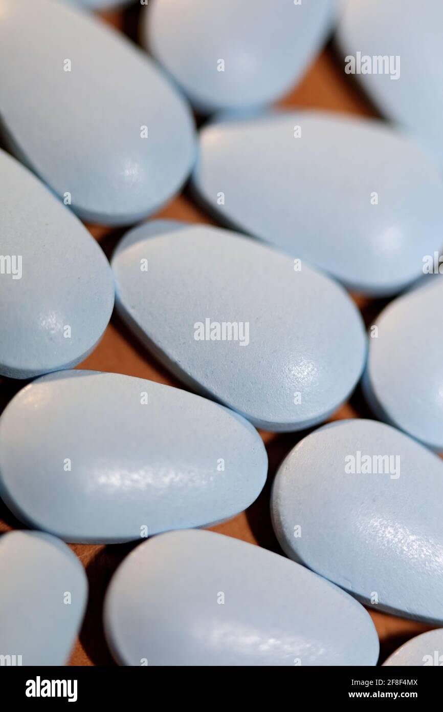 Blue pharmaceutical pills close up medical modern background high ...