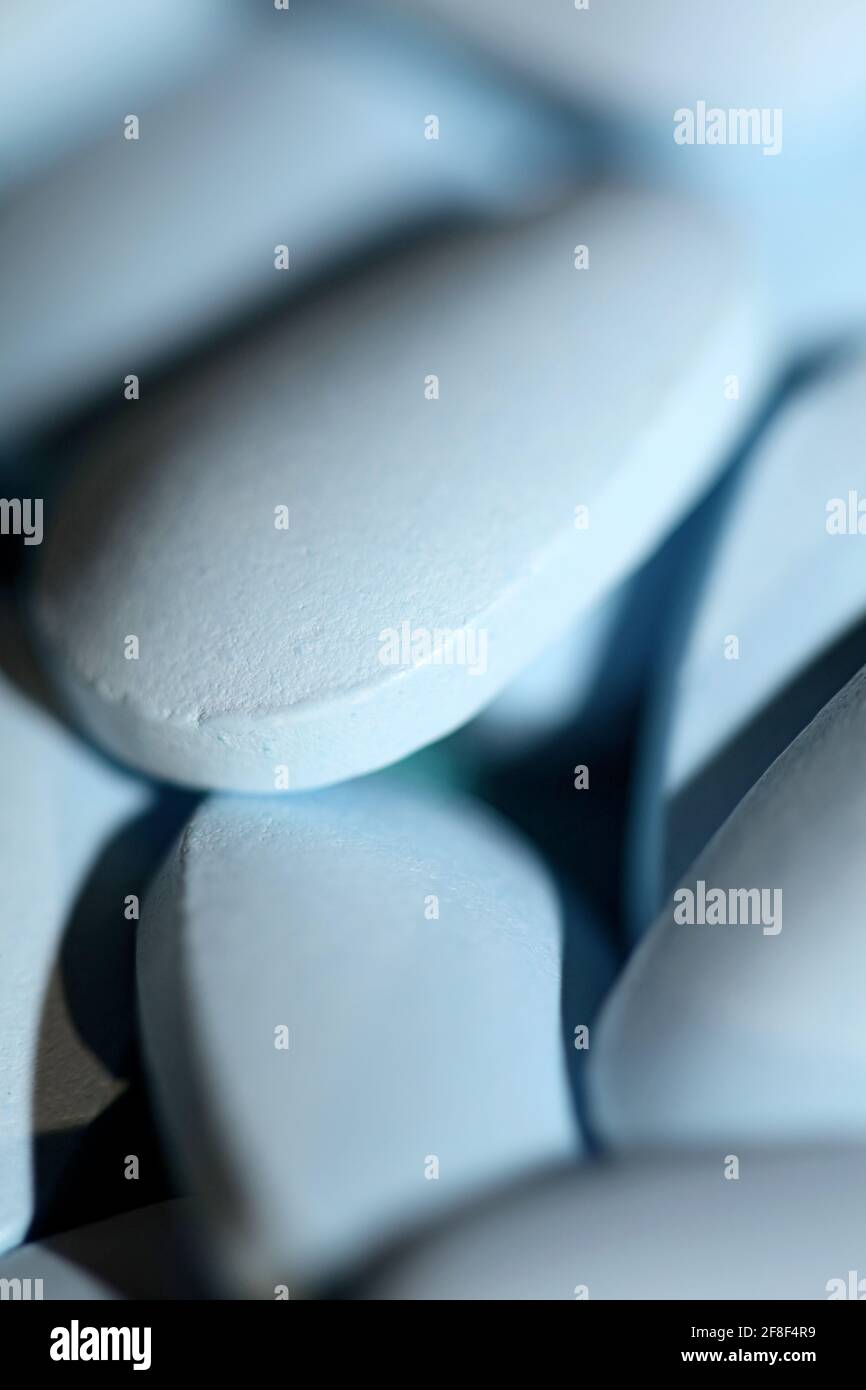Blue pharmaceutical pills close up medical modern background high ...