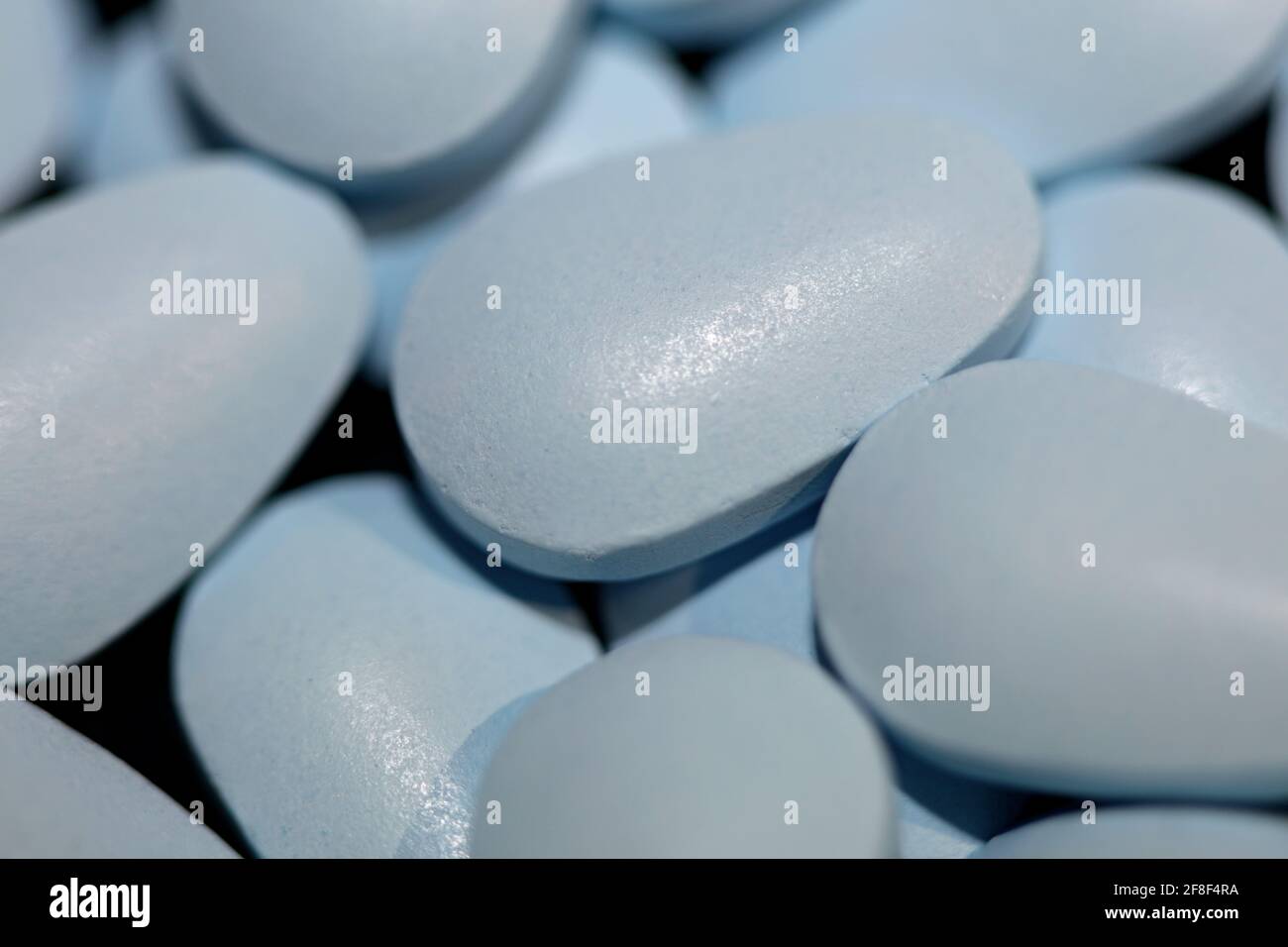 Blue pharmaceutical pills close up medical modern background high ...