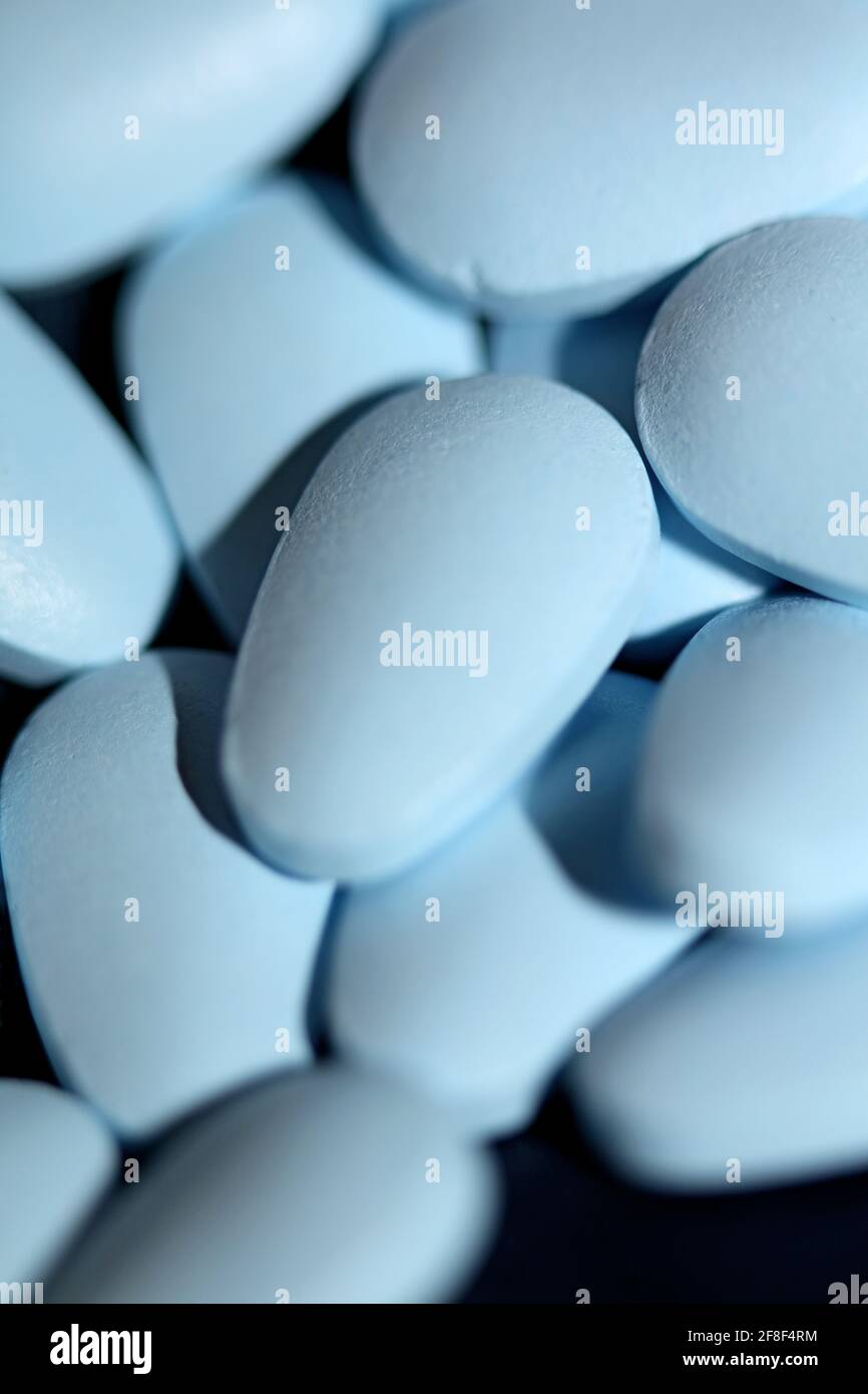 Blue pharmaceutical pills close up medical modern background high ...