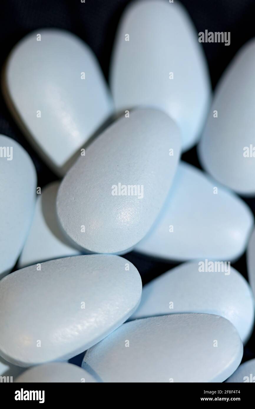 Blue pharmaceutical pills close up medical modern background high ...