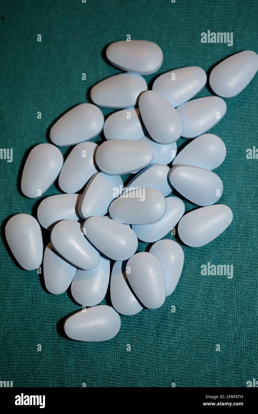 Blue pharmaceutical pills close up medical modern background high ...