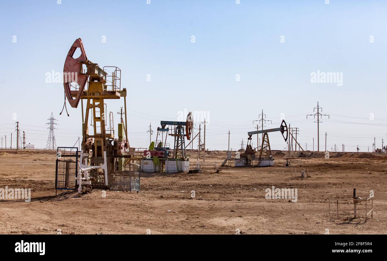 Oil pumping jacks in desert. OIl field Zhanaozen, Kazakhstan Stock ...