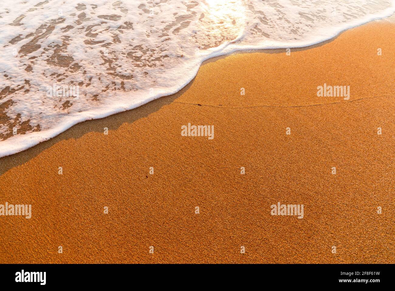 Soft sea wave on a sandy beach Stock Photo - Alamy