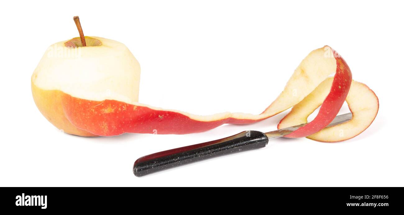 Peeling an apple, isolated over white background Stock Photo - Alamy