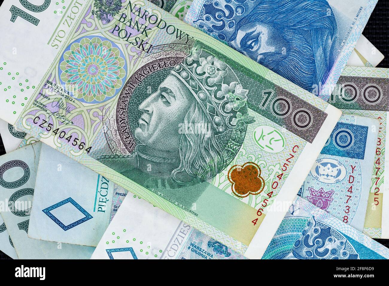 Polish banknotes of PLN 100 and PLN 50 randmply composed. Photo taken ...