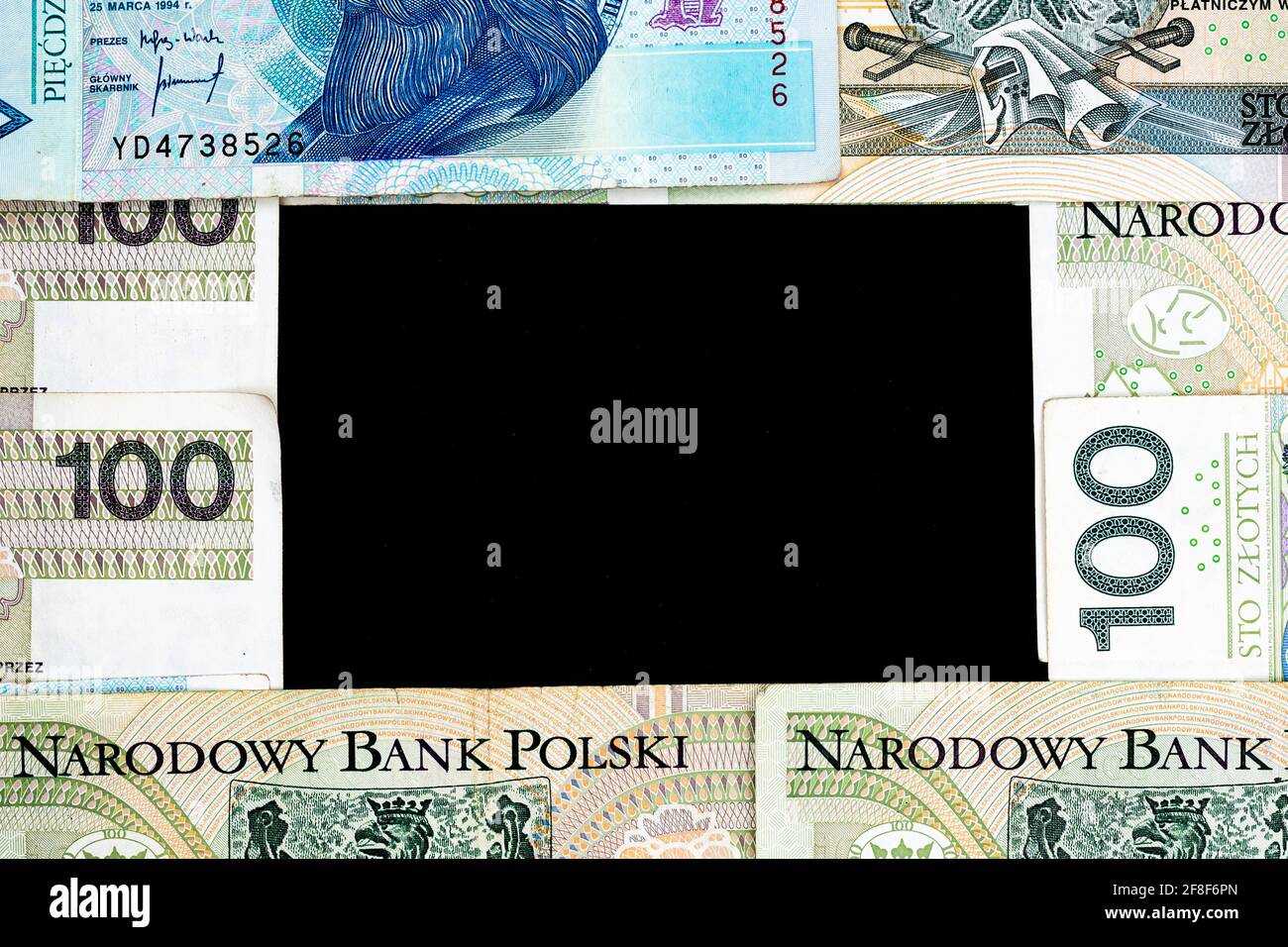 Polish banknotes of PLN 100 and PLN 50 on a black background. Photo ...