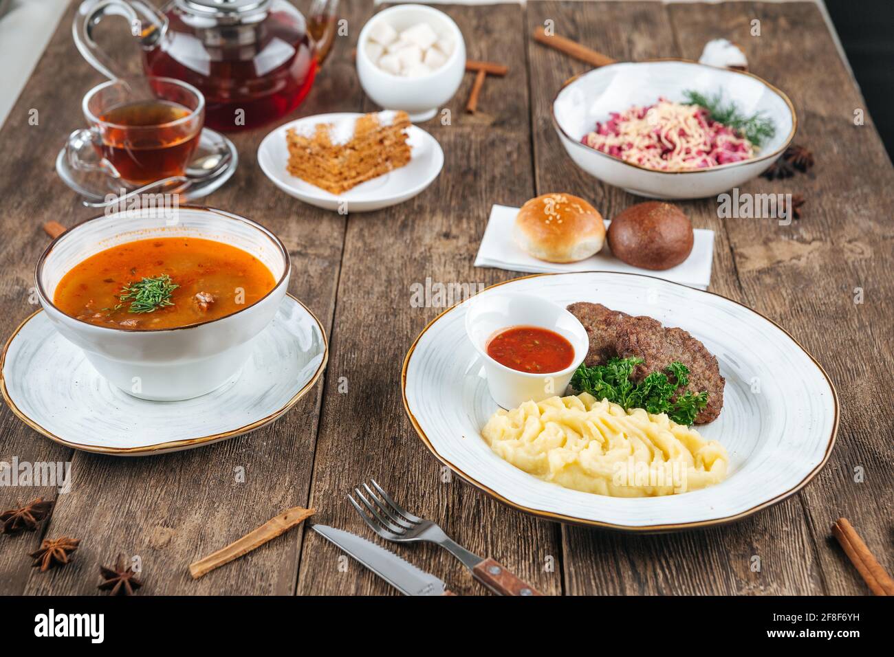 Wooden table served with russian dishes for lunch Stock Photo - Alamy