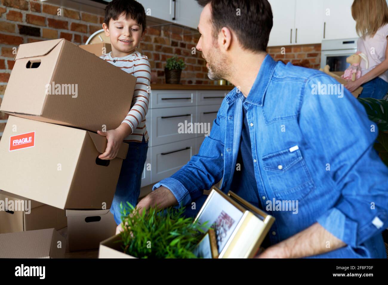 Little boy helping with the move Stock Photo - Alamy