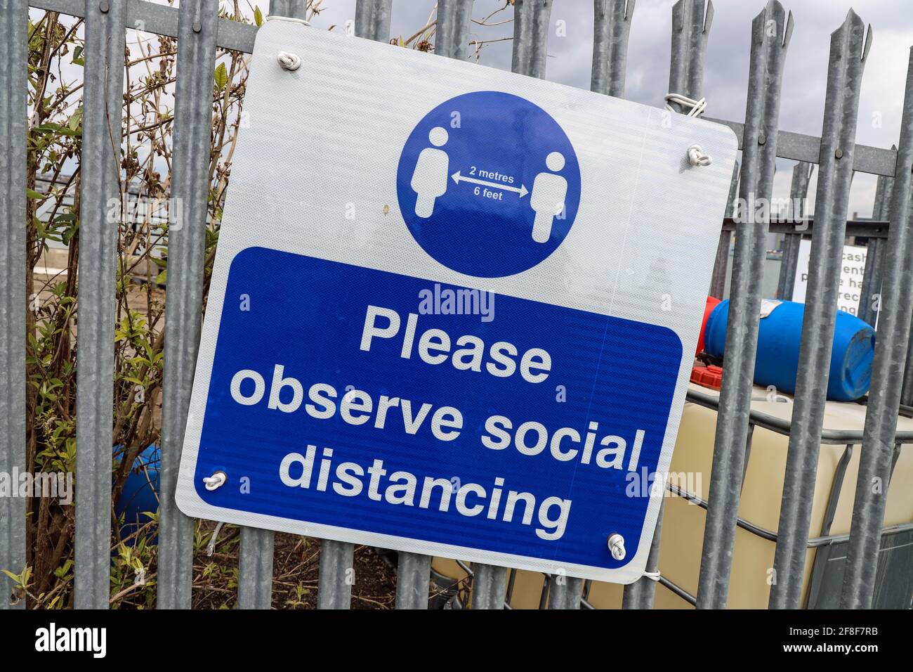 Social distancing warning on fencing near the Torpoint Ferry Cornwall ...