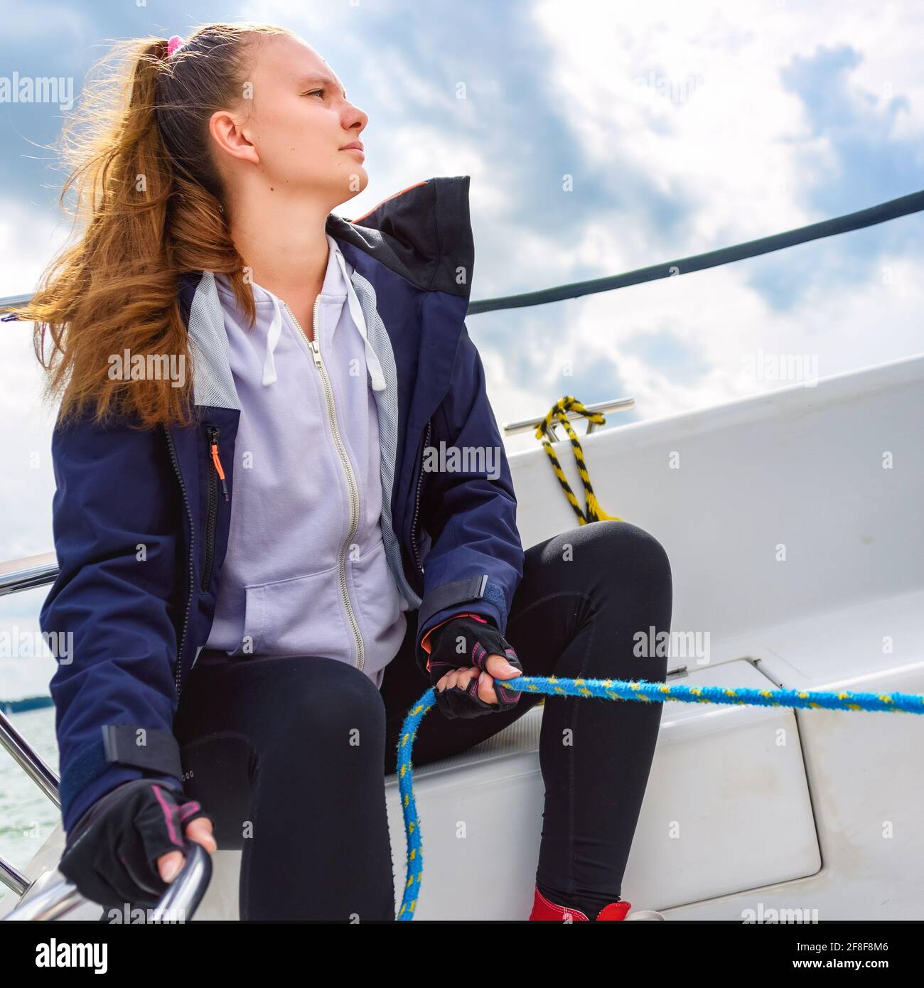 Woman on sailboat hi-res stock photography and images - Alamy