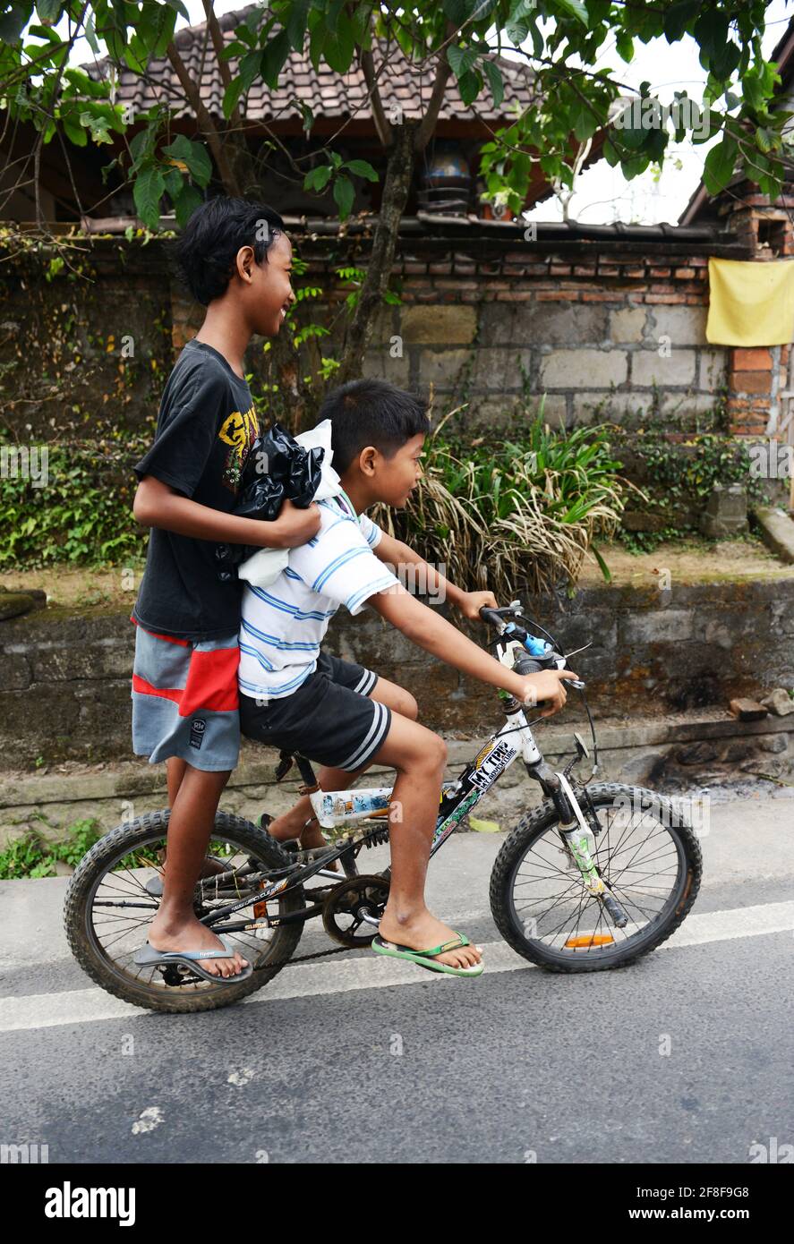 Boys playing with their bicycle hi-res stock photography and images - Alamy