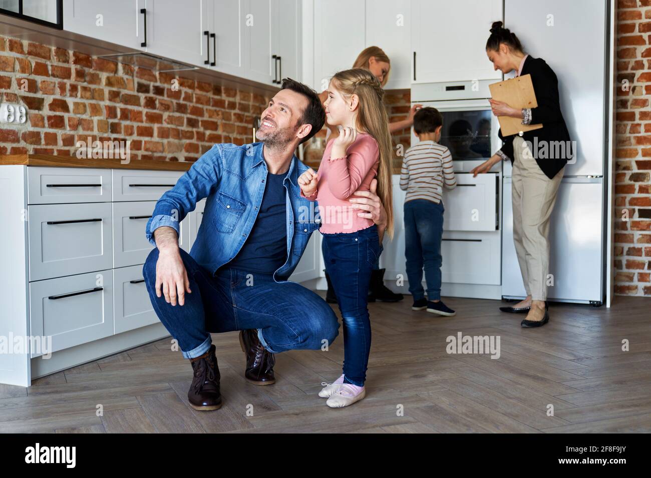 Big family checking their future house Stock Photo - Alamy