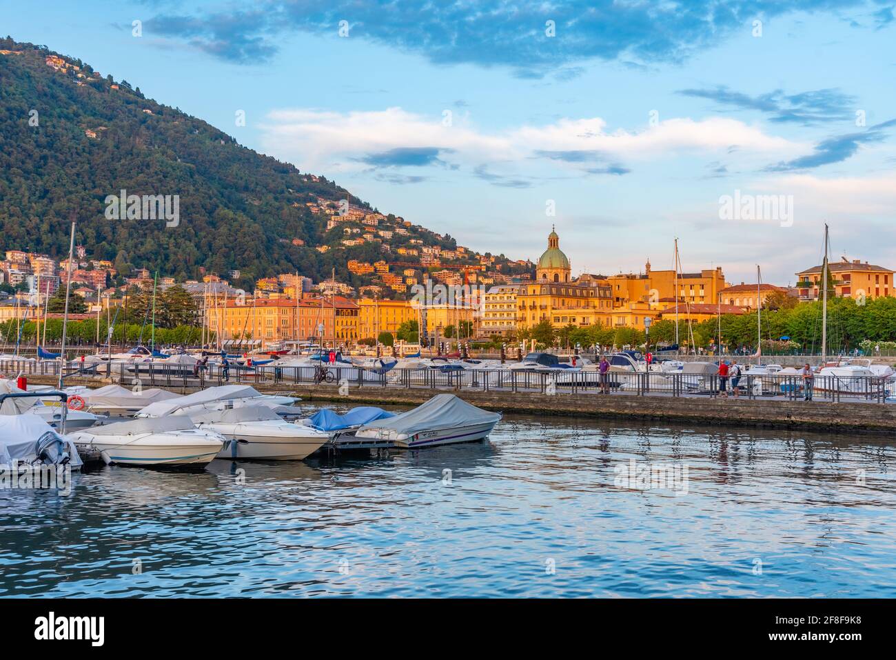 Como viewed behind marina during sunset, Italy Stock Photo - Alamy