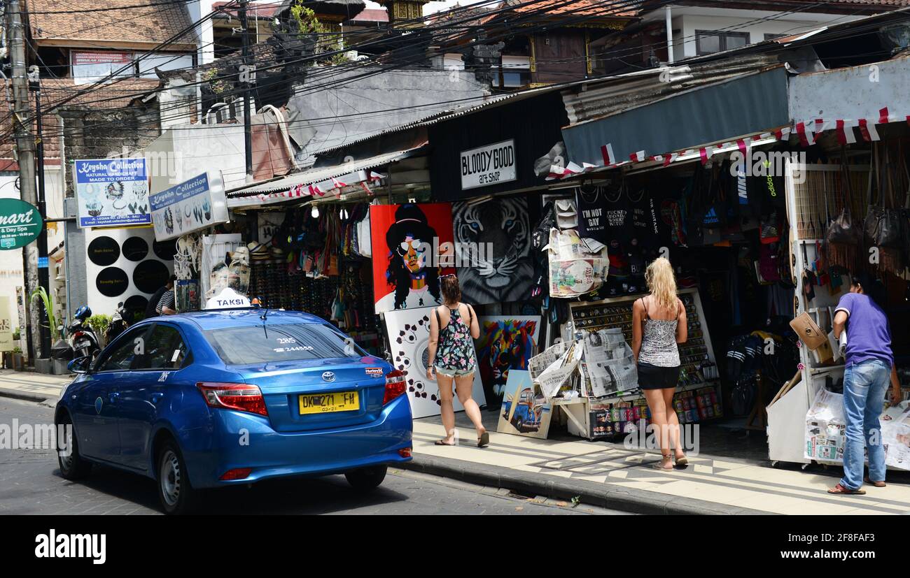 Tourist walking on Jln Legian- main street in Kuta, Bali, Indonesia ...