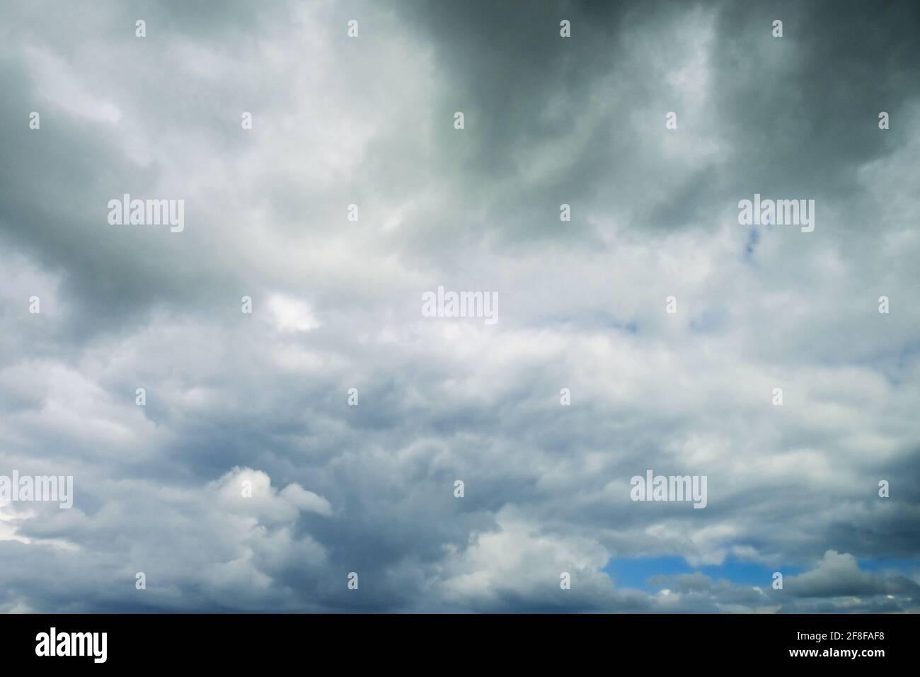 Dramatic real sky with grey clouds before storm. The real sky ...