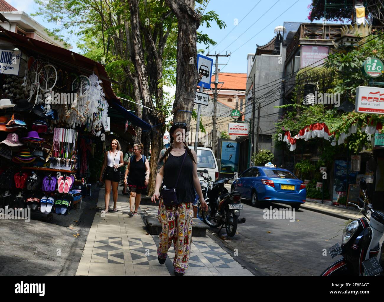 Tourist walking on Jln Legian- main street in Kuta, Bali, Indonesia ...